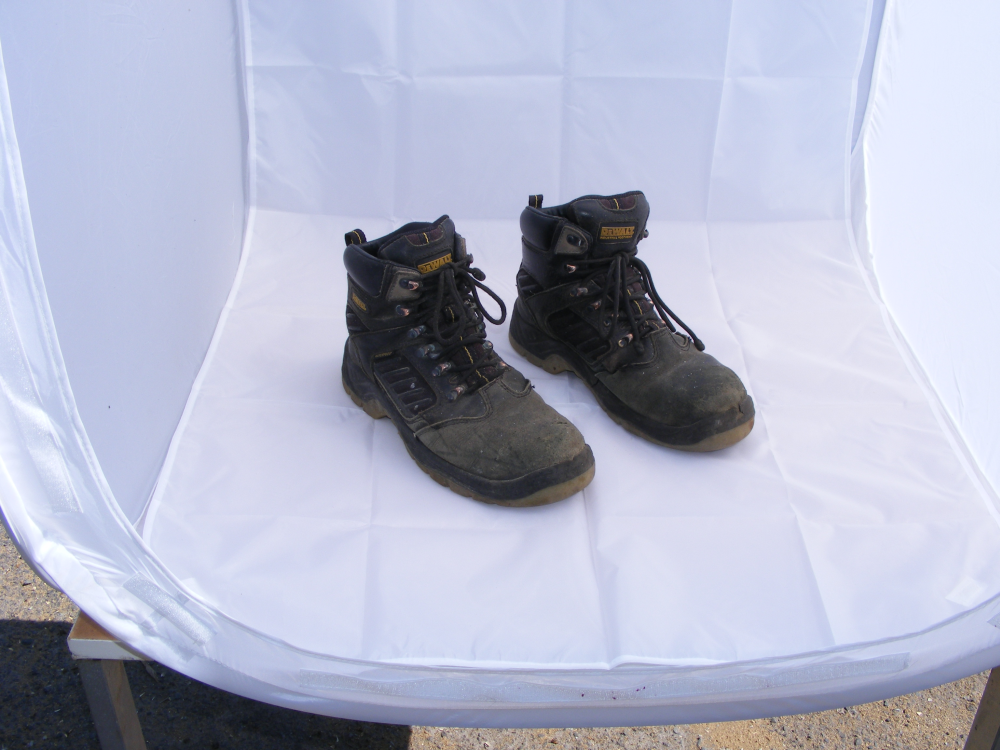 Nest box for sparrows made from old boots and pallet planks